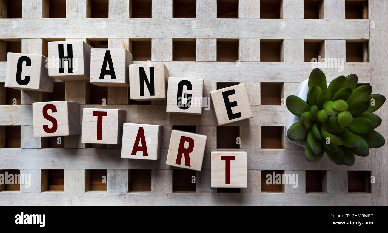 CHANGE START text on wooden blocks and vintage table with cactus Stock ...