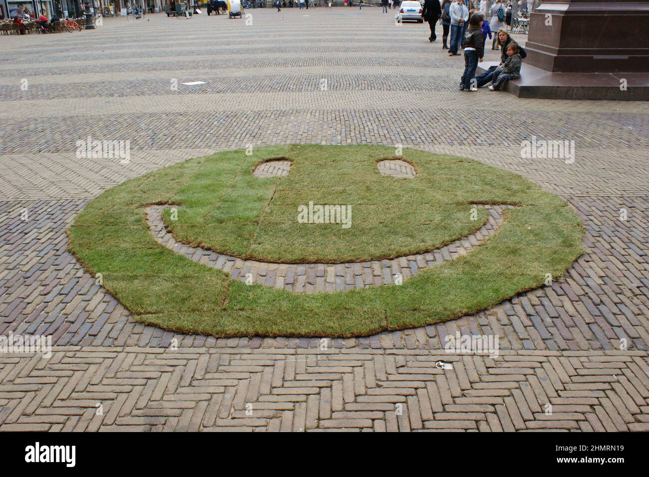 Beautiful view of a street art smiley face on the pavement made of ...