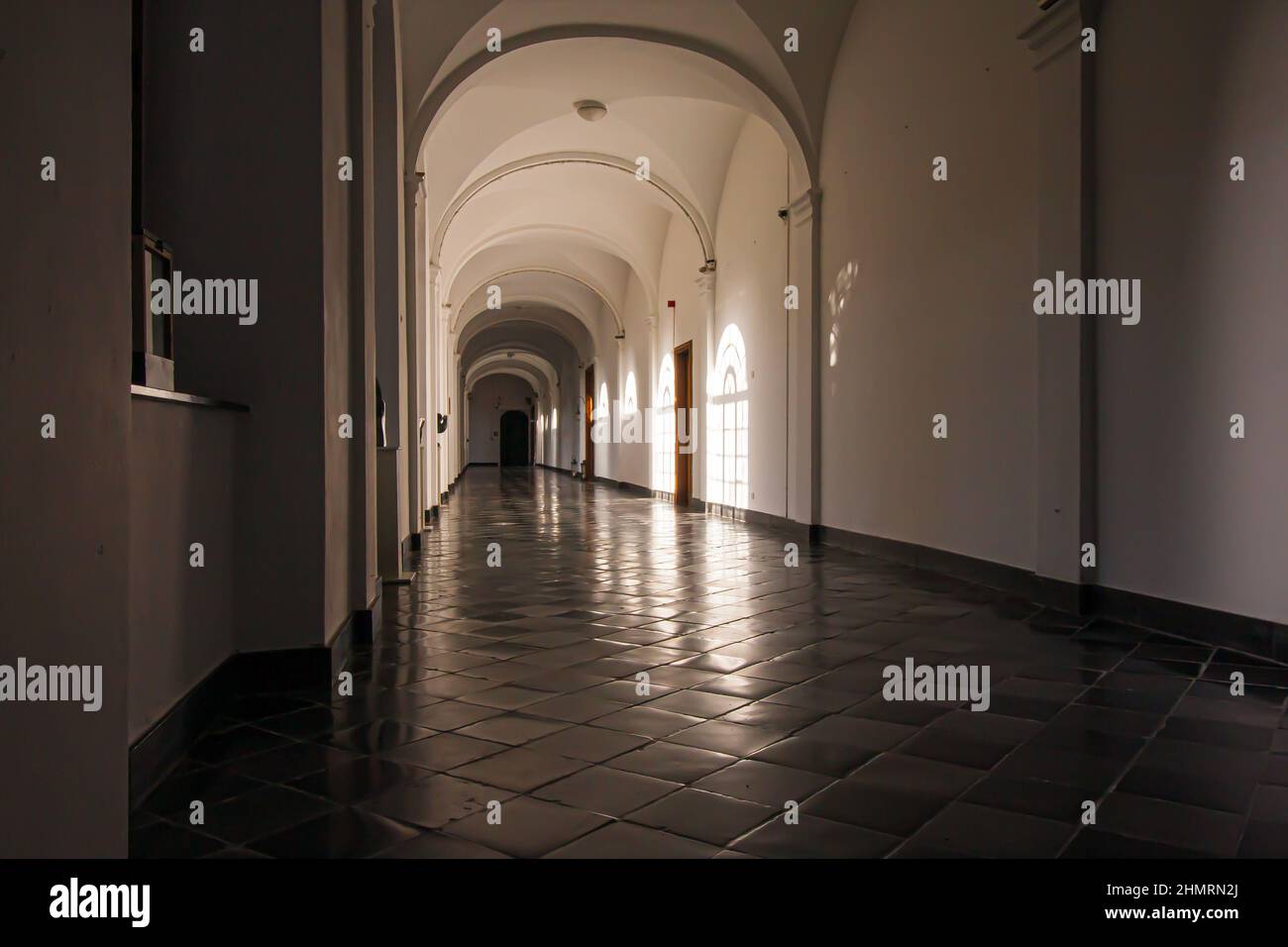 Beautiful interior view of a long corridor with arch shape and tiled ...