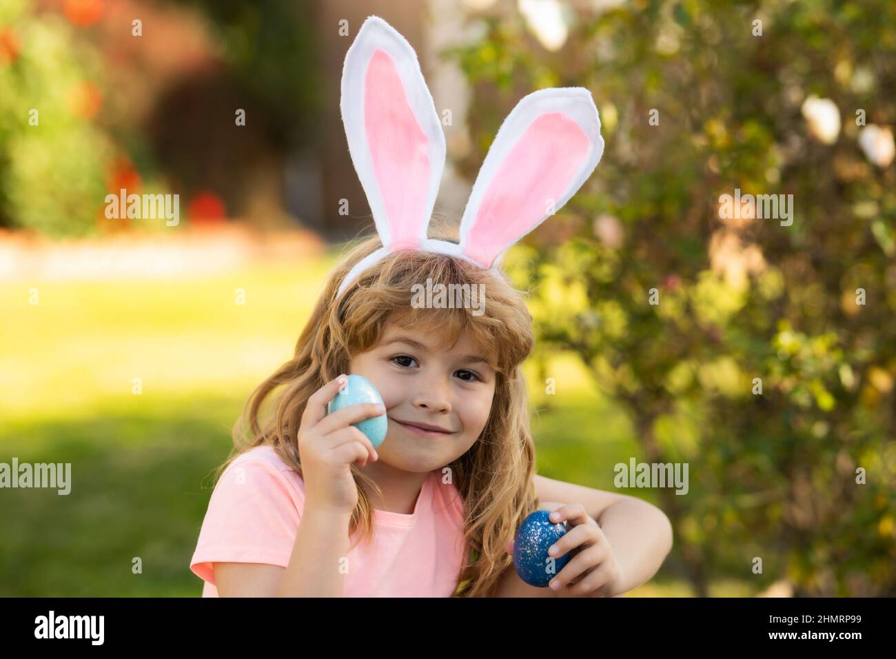Child boy hunting easter eggs. Kid with easter eggs and bunny ears ...