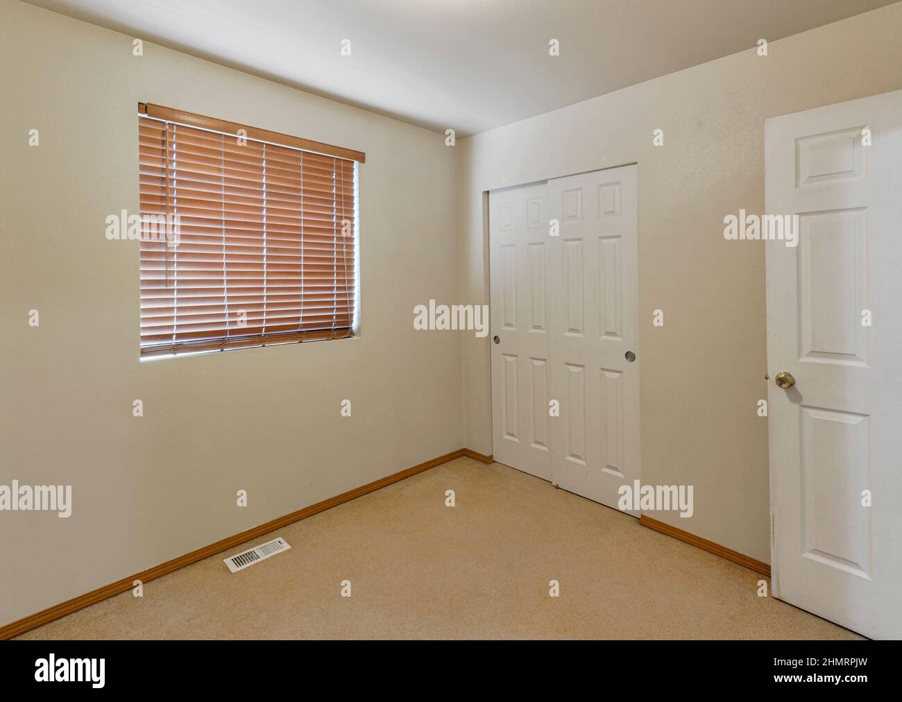 Modern residential empty bedroom interior Stock Photo - Alamy