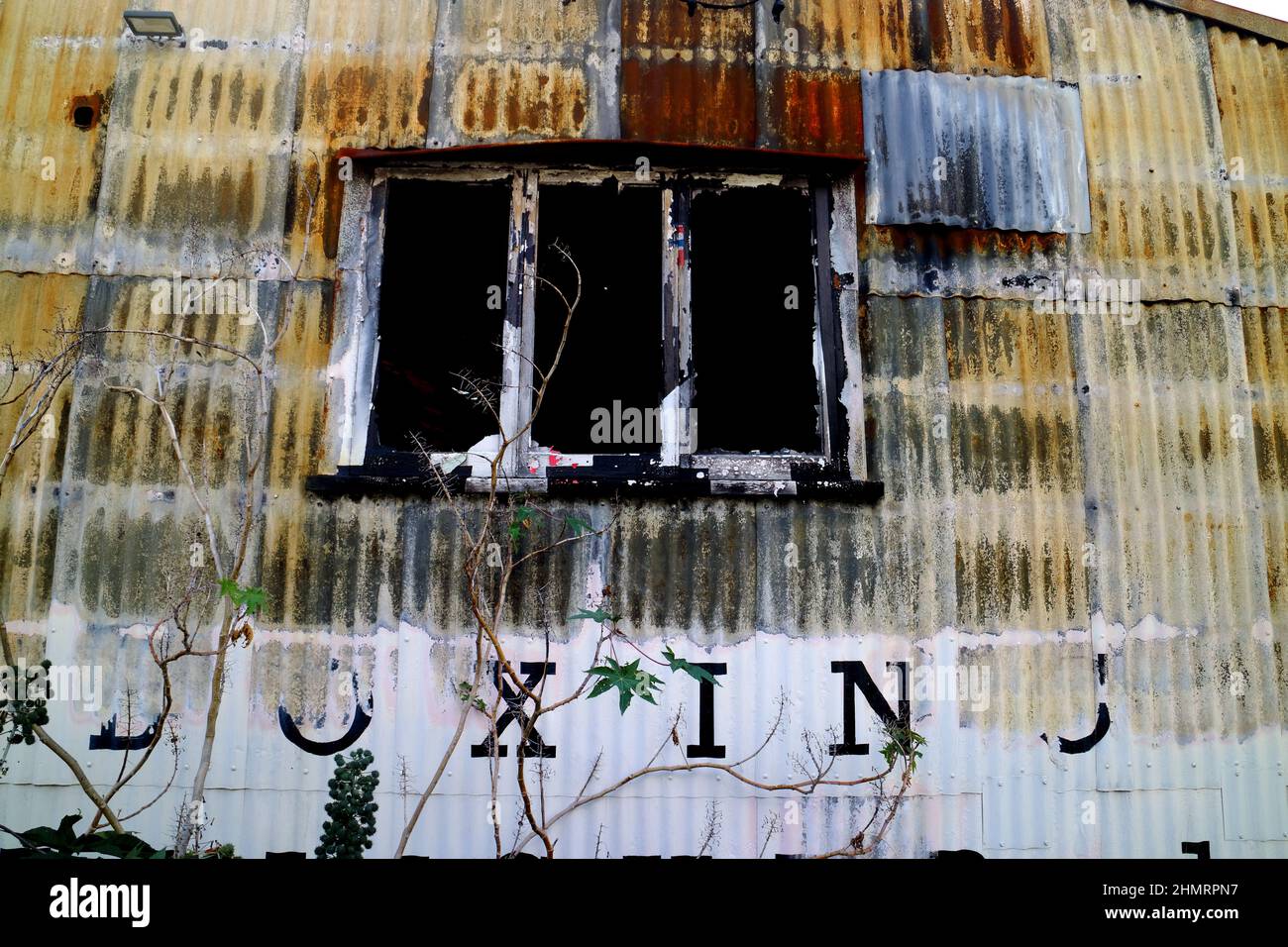 Facade and window of a burned building that used to be a boxing gym ...