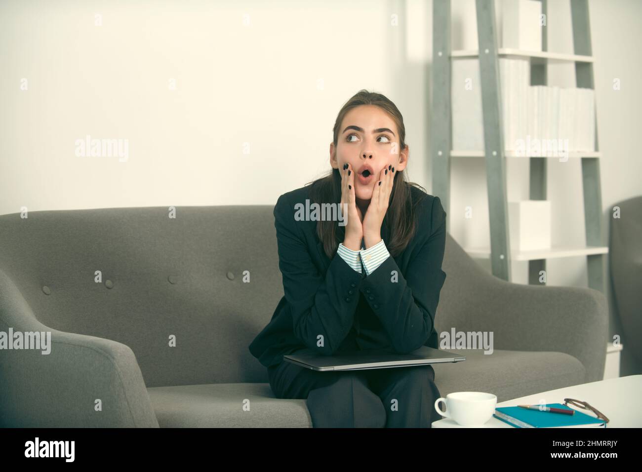 Surprised funny business woman entrepreneur working in office ...