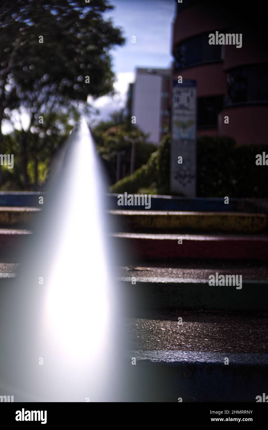 Stairs from stone on a city street with bright ray of light on the ...