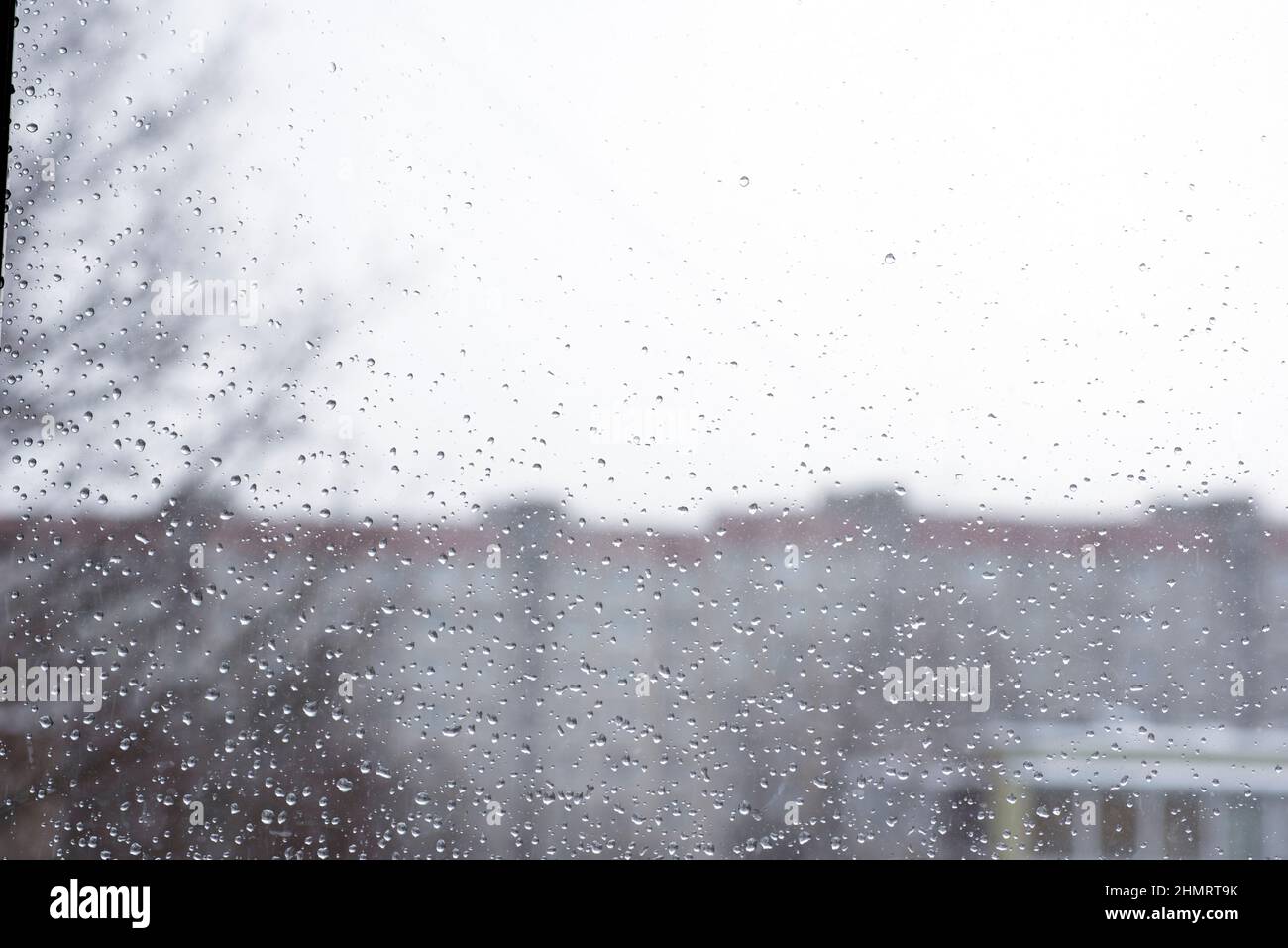 Rain drops on the surface of window panes with urban background Stock ...