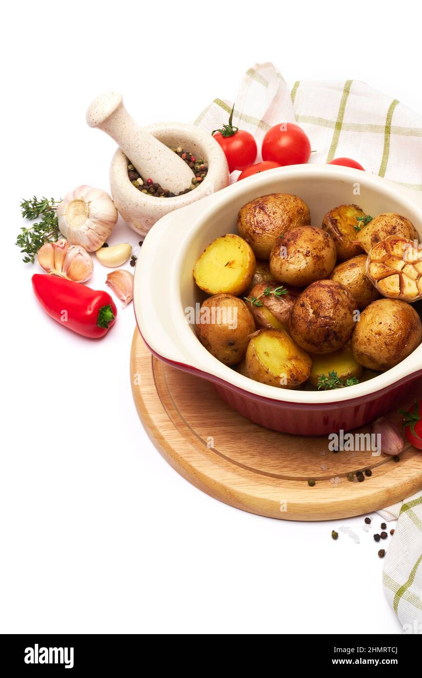 Baked potato in a clay pot isolated on white background Stock Photo - Alamy