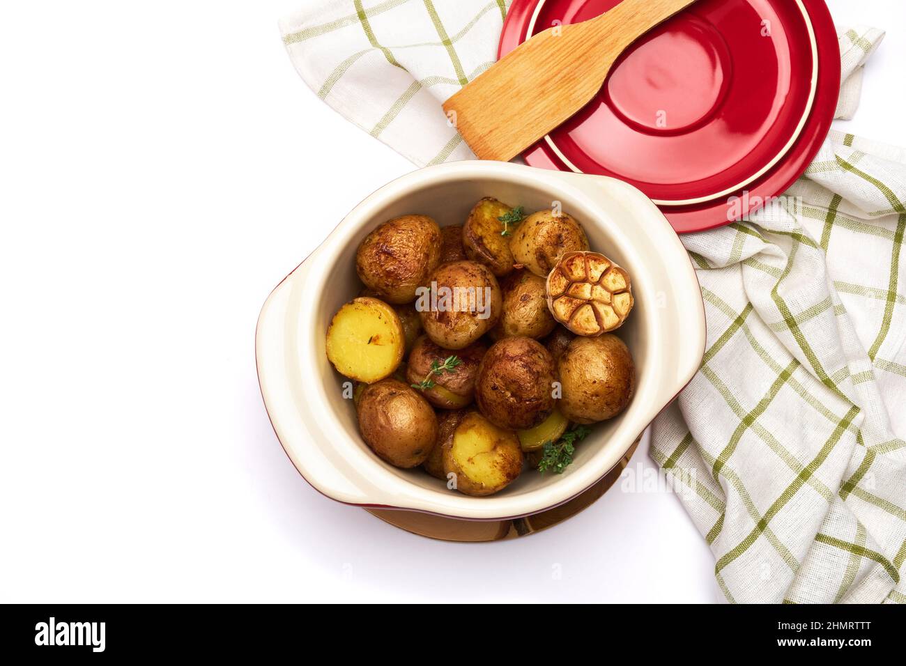 Baked potato in a clay pot isolated on white background Stock Photo - Alamy