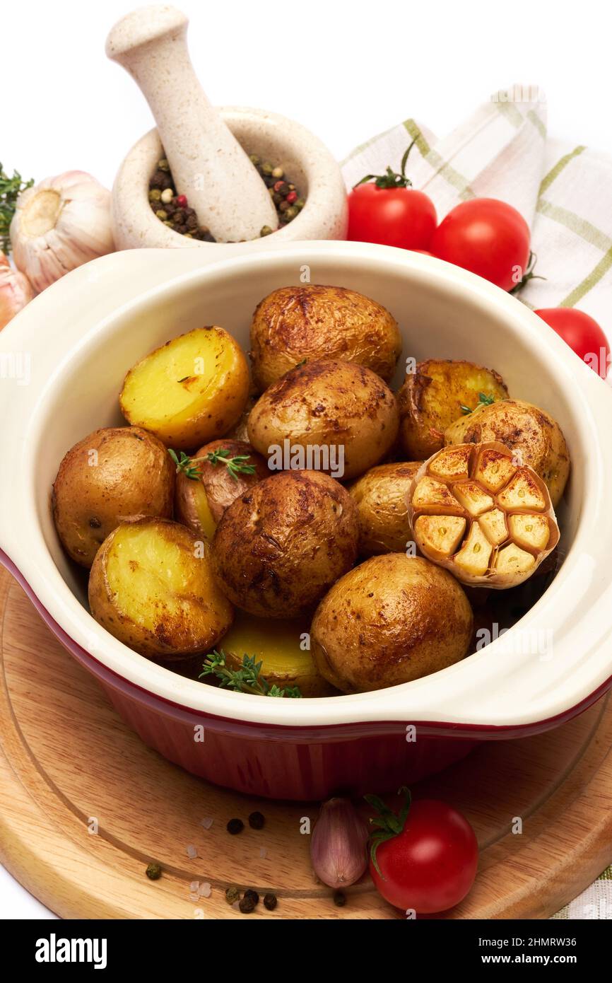 Baked potato in a clay pot isolated on white background Stock Photo - Alamy
