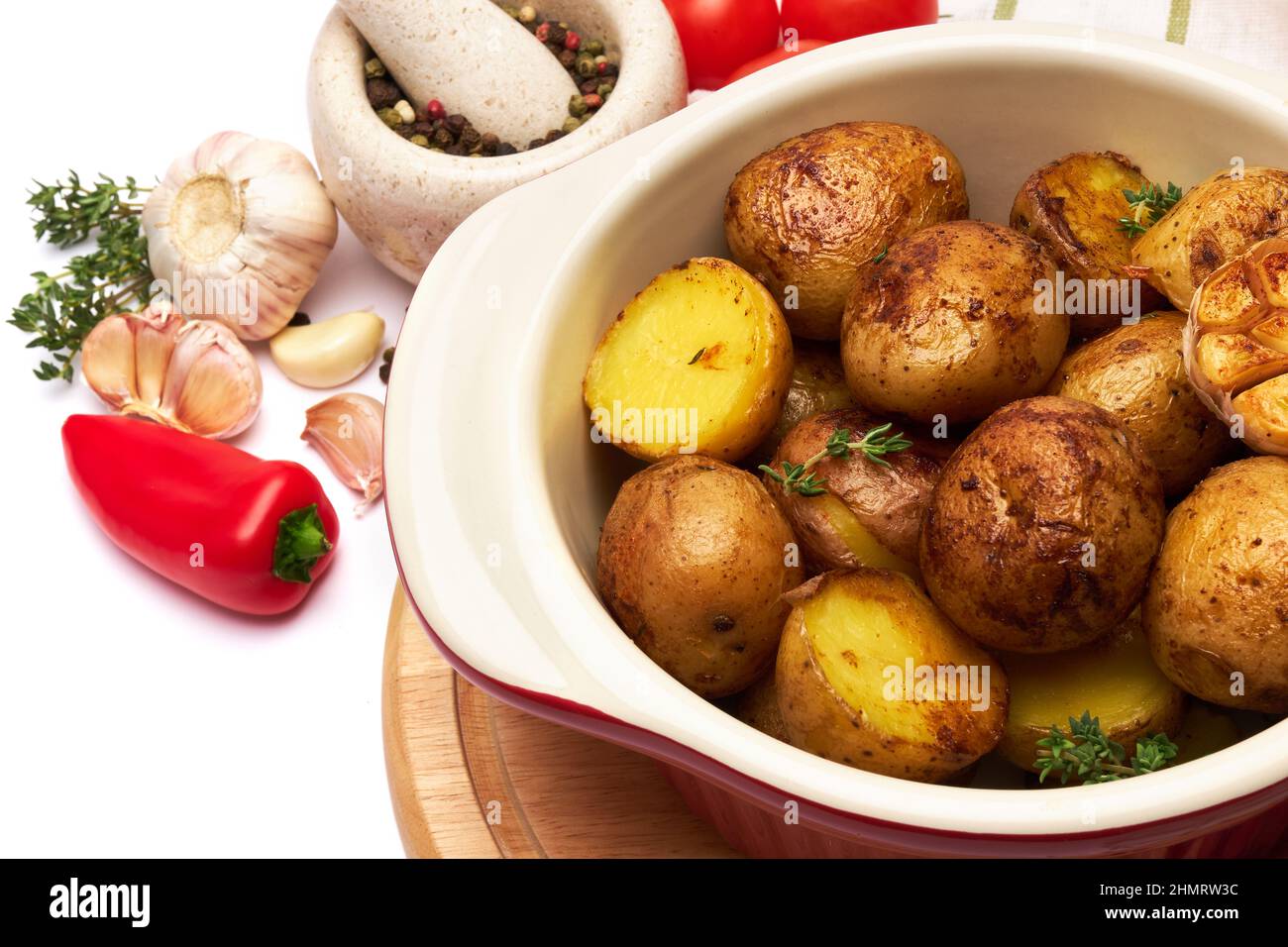 Baked potato in a clay pot isolated on white background Stock Photo - Alamy