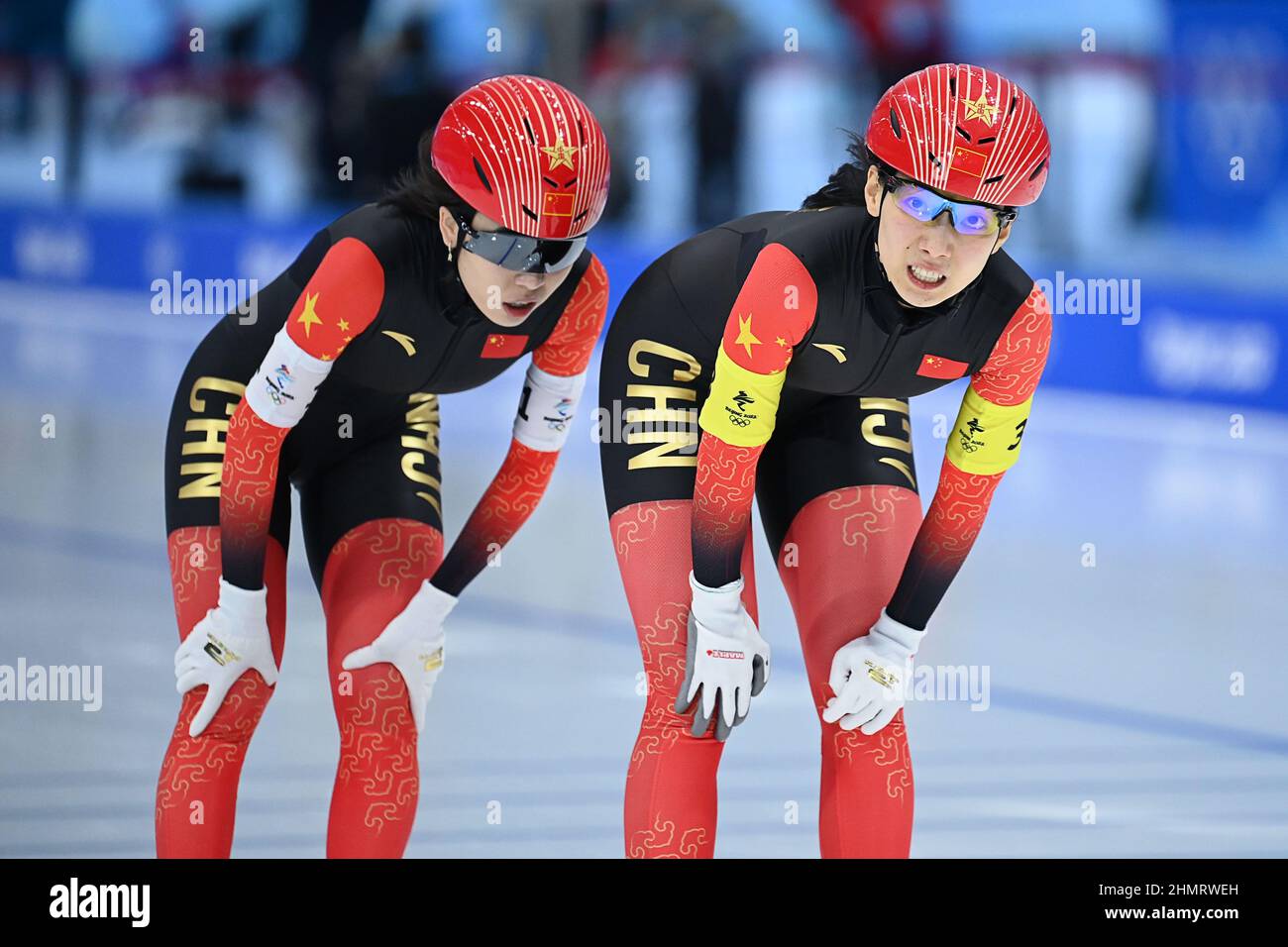 Beijing, China. 12th Feb, 2022. Ahenaer Adake (L) and Li Qishi of China ...