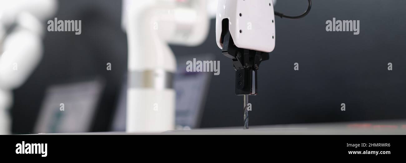 Robot arm automatic drilling machine at industrial production plant ...