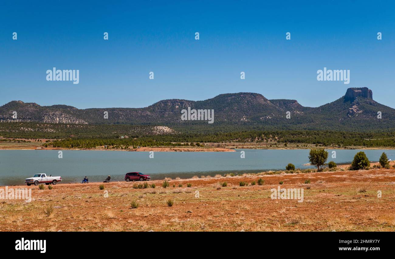 Anglers at Tsaile Lake, Tsaile Butte on right in distance, Chuska ...