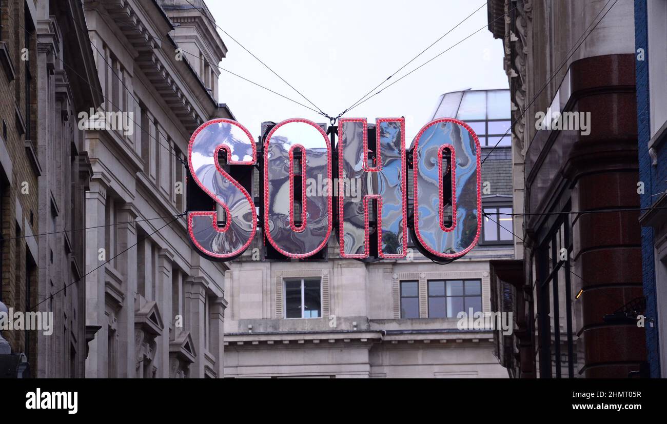 A 'Soho' sign or signage above Beak Street, Soho, London, UK, welcomes ...