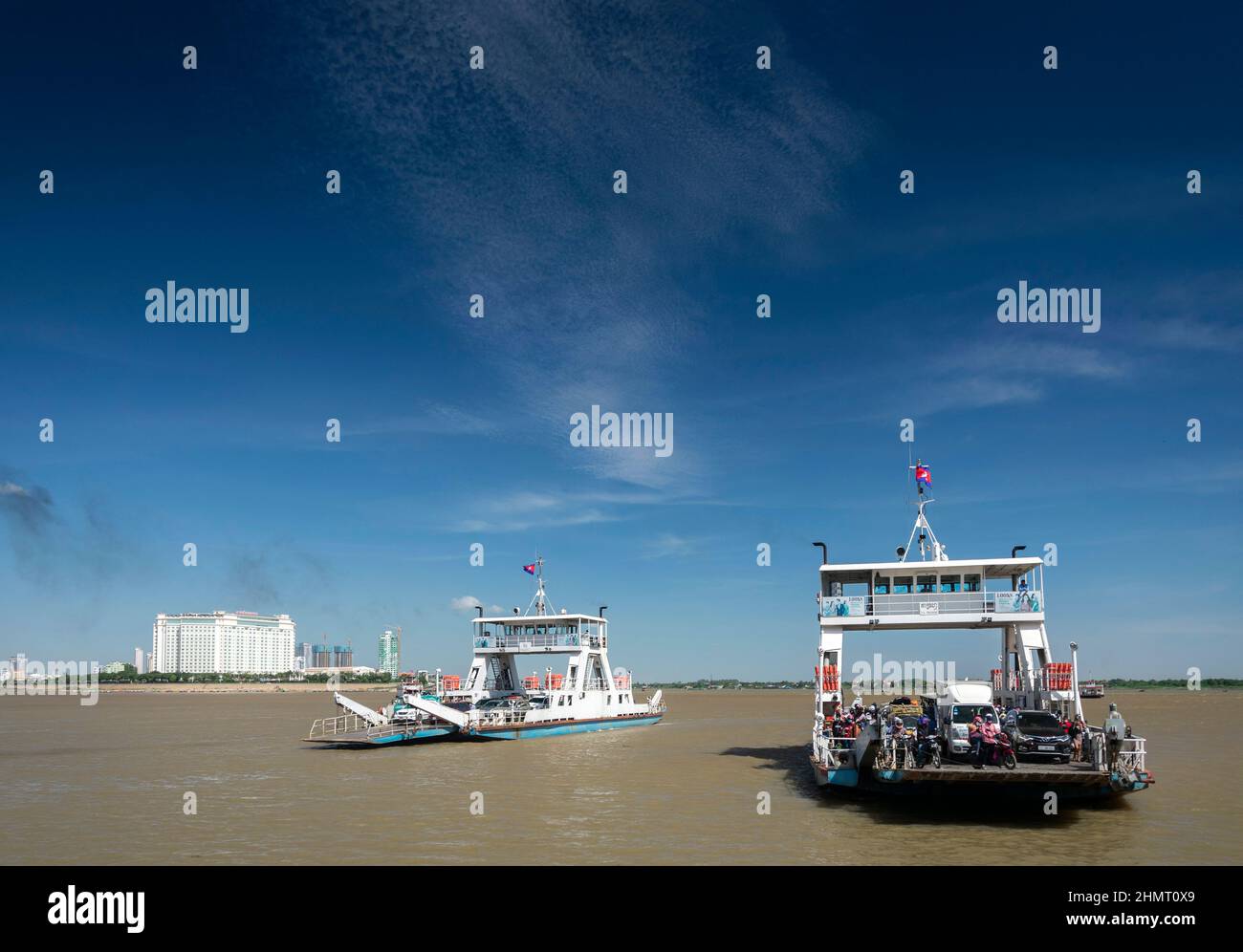 passenger ferry boat crossing the Mekong river in Phnom Penh Cambodia ...