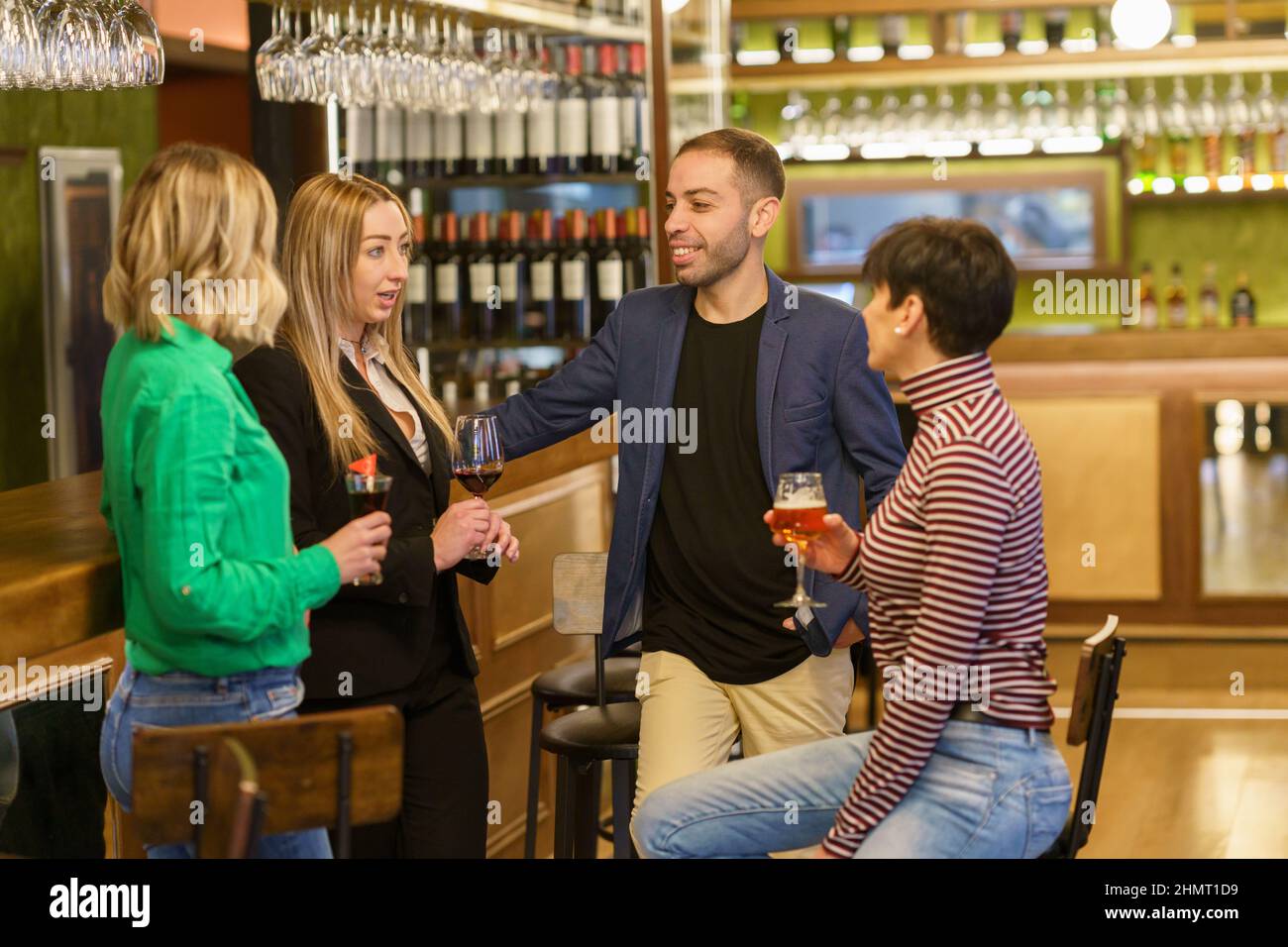 Friends talking during meeting in a nice pub Stock Photo - Alamy