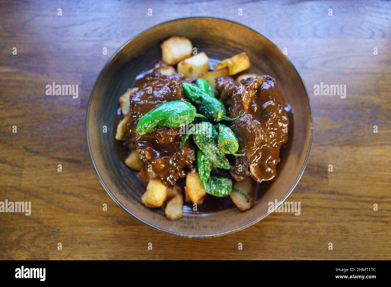 Bull's tail cooked and ready to eat in a Spanish restaurant Stock Photo ...