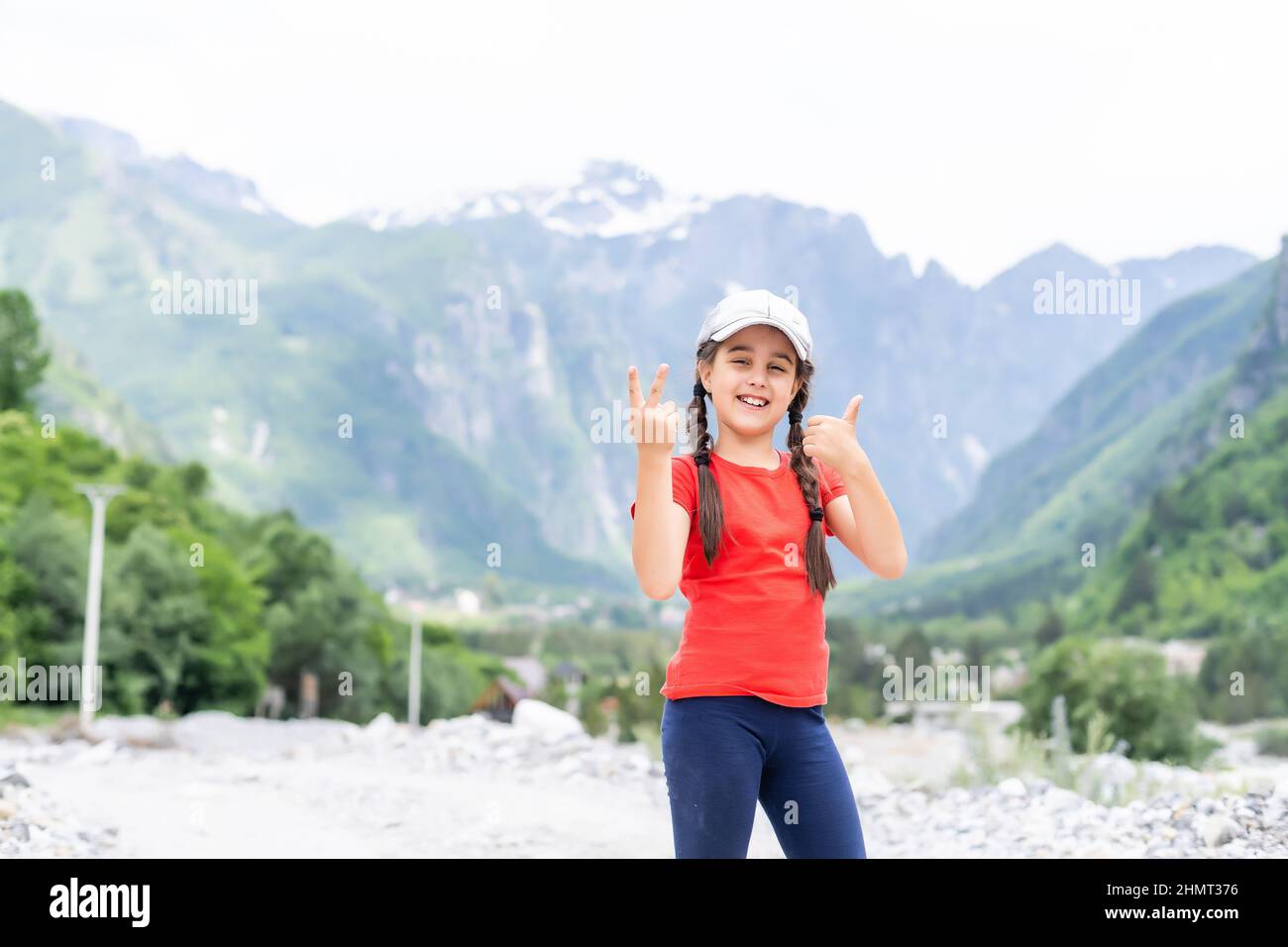 Portrait of a cute little girl in mountains Stock Photo - Alamy