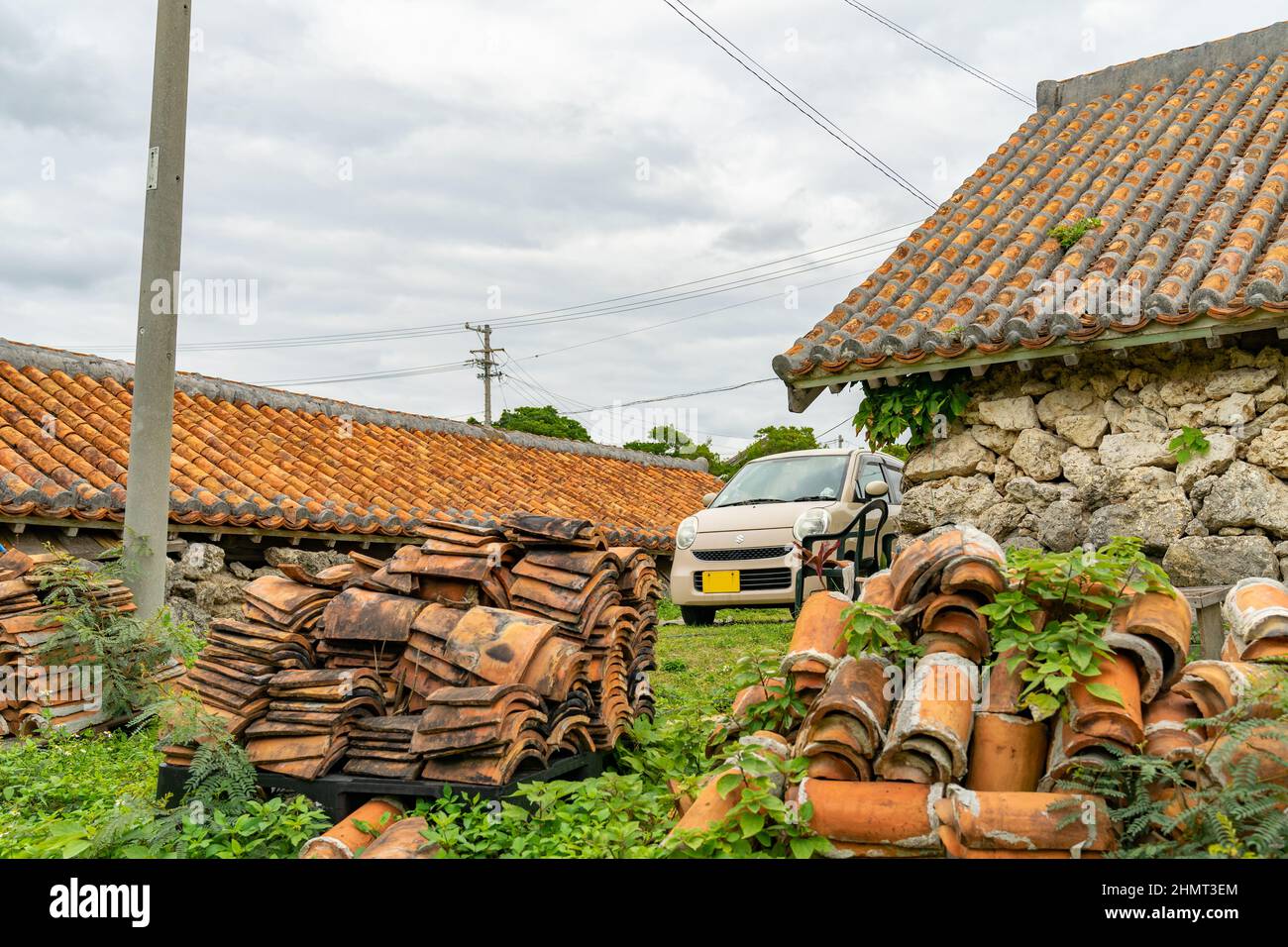 A photo of a bricks, car and a house which is taken at rural town of ...