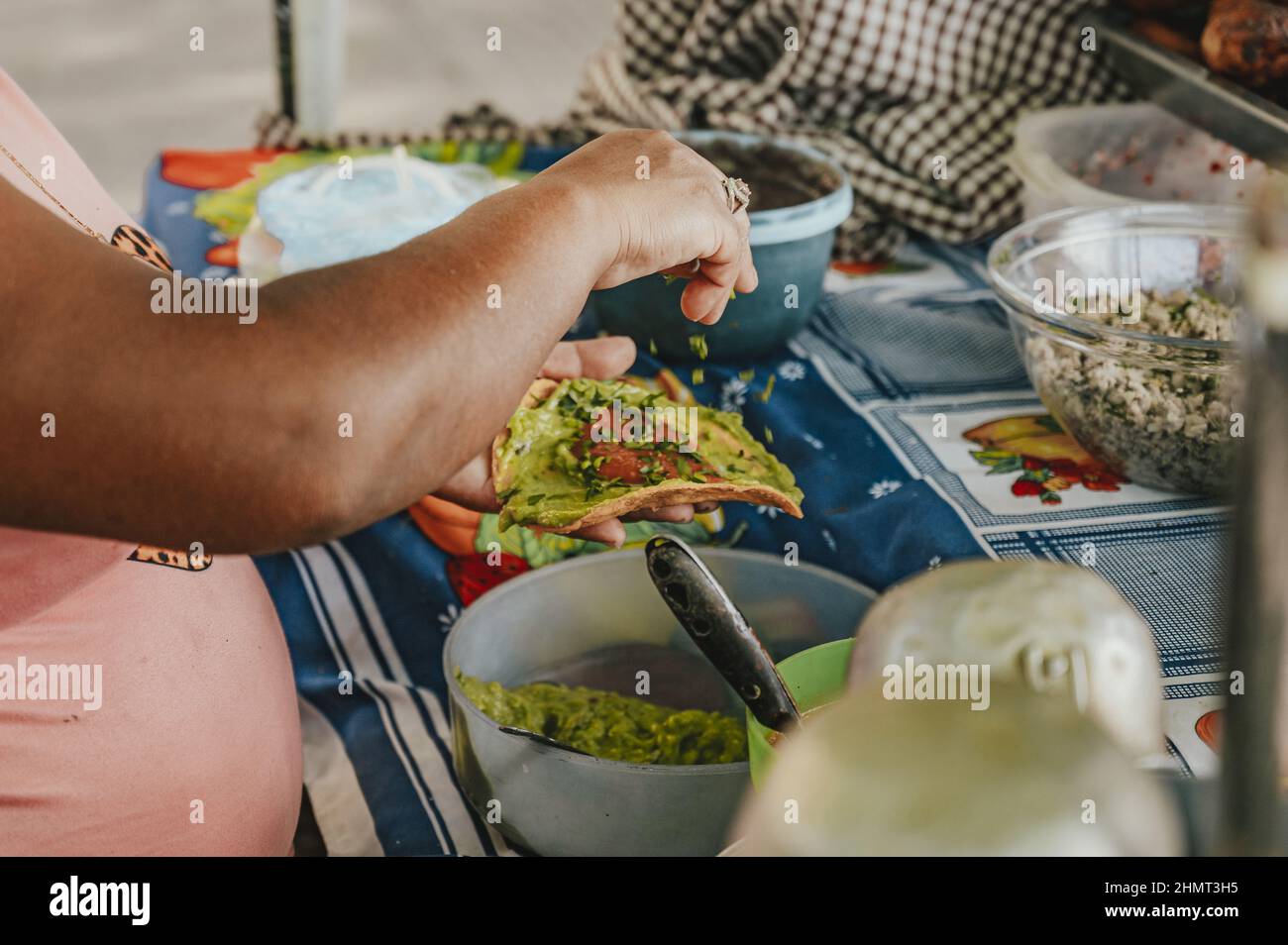 Female hands adding ingredients to the tortilla in the fast-food ...