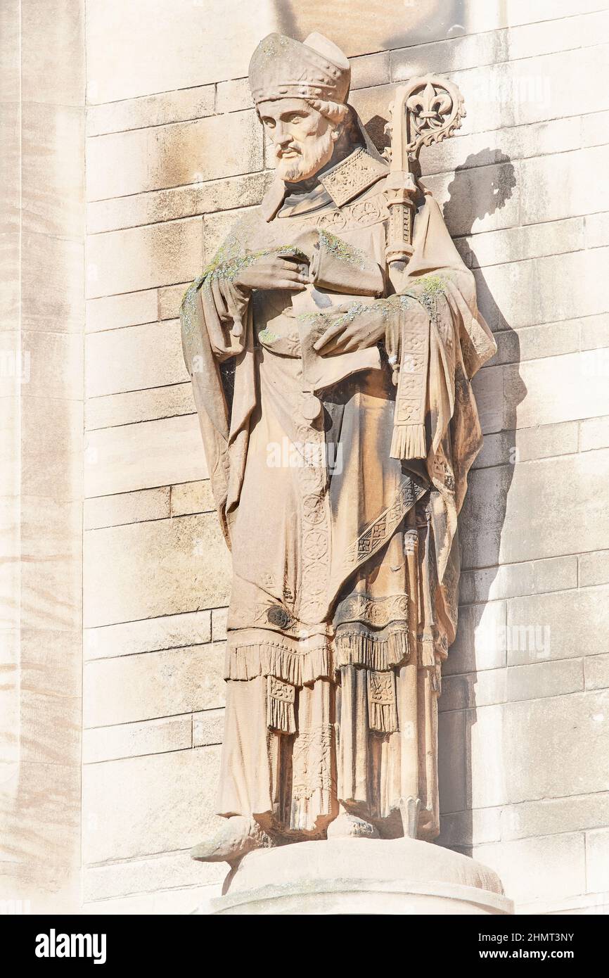 Statue on the outside wall of Gonville & Caius college, university of ...