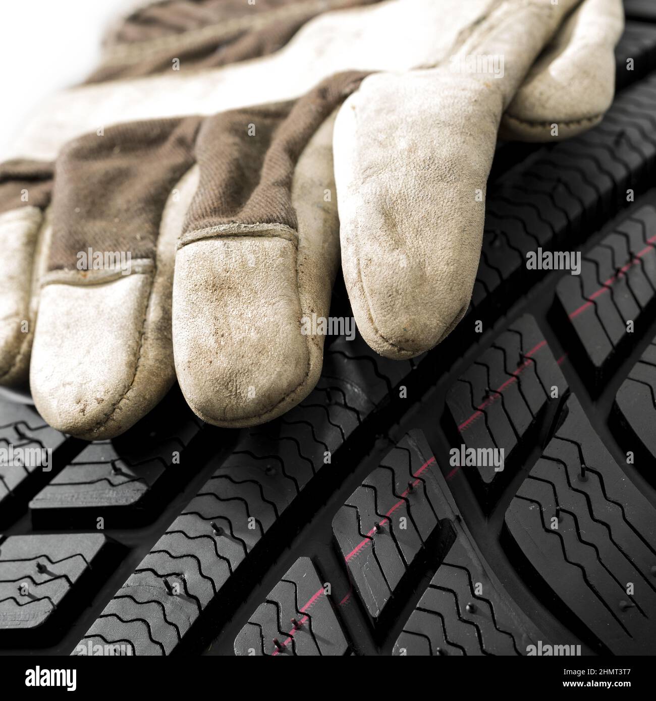 Car tires close-up with glove Winter wheel profile structure on white background Stock Photo - Alamy
