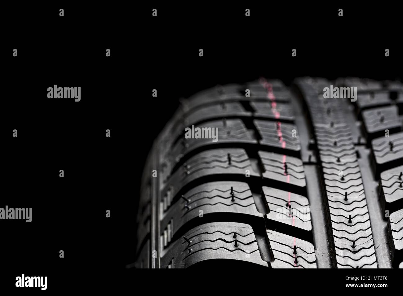 Winter Car tires close-up wheel profile structure on black background Stock Photo - Alamy