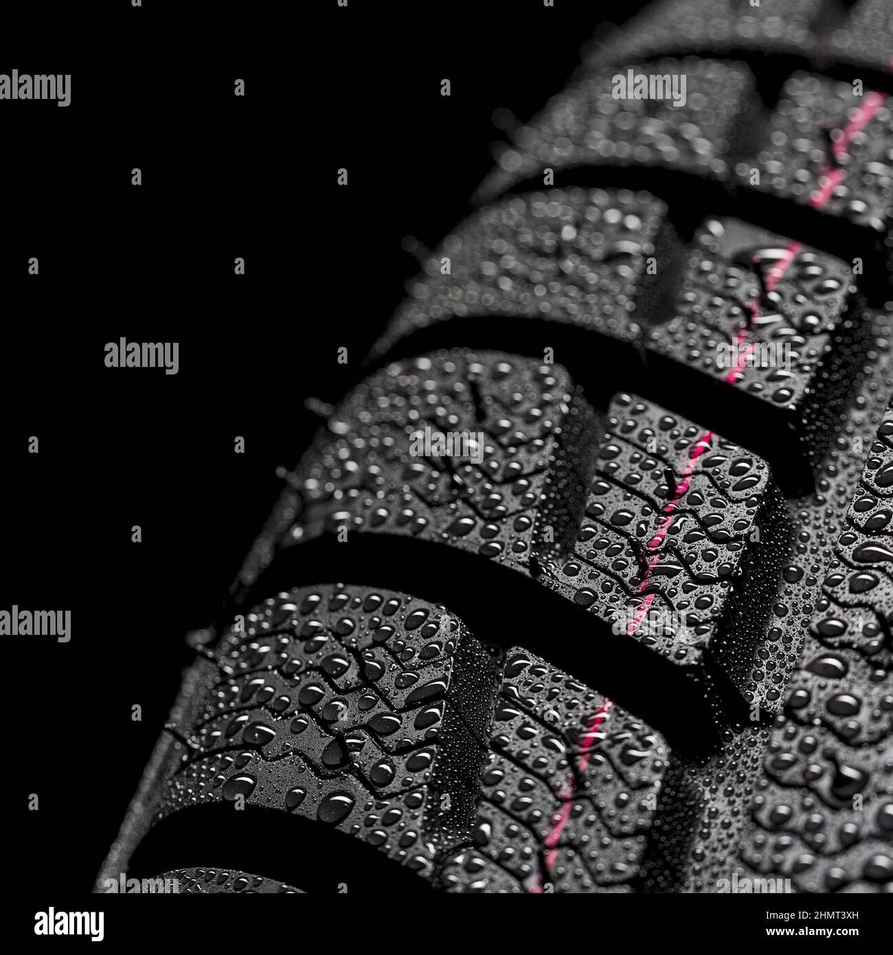 Car tires close-up Winter wheel profile structure with waterdrops on ...