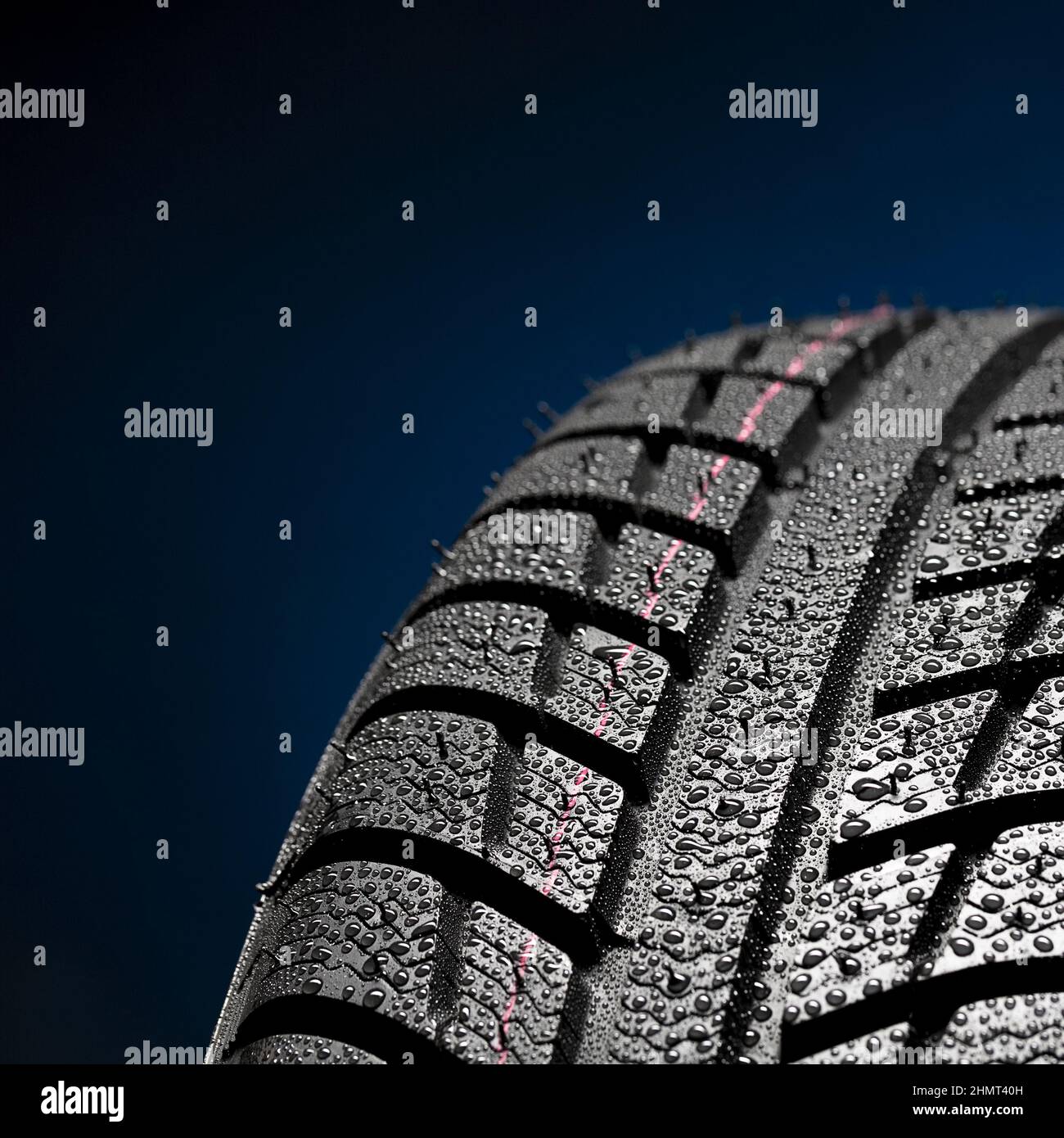 Car tires close-up Winter wheel profile structure with waterdrops on ...