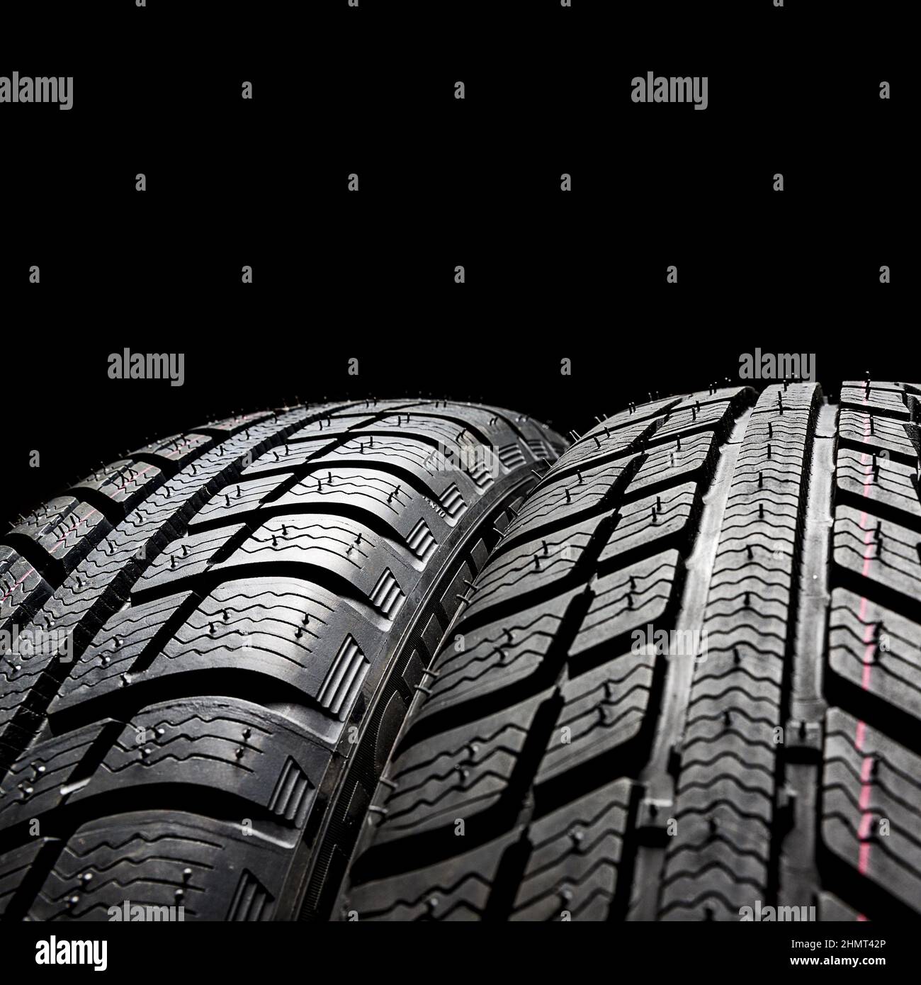Car tires close-up Winter wheels profile structure on black background Stock Photo - Alamy