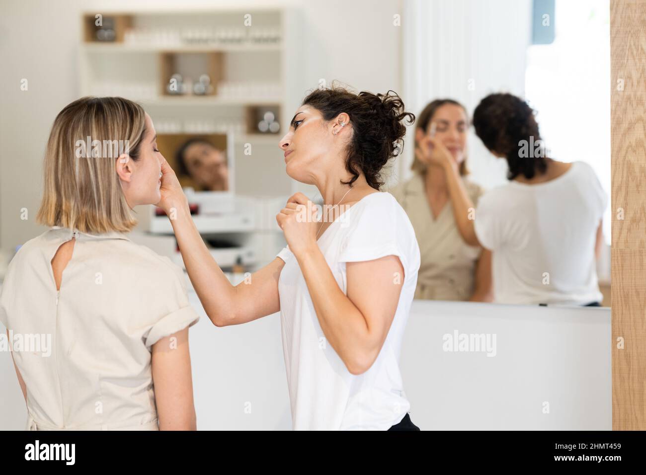 Cosmetologist doing beauty procedure on face of client Stock Photo - Alamy