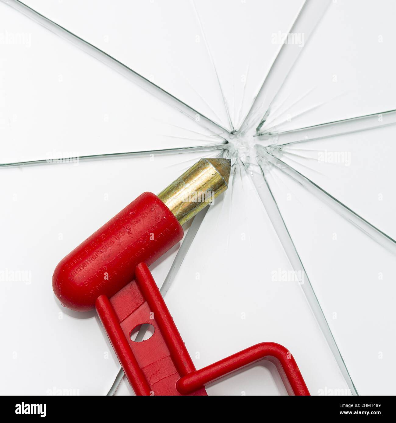 red emergency hammer with breaked glass window rescue hammer on white ...