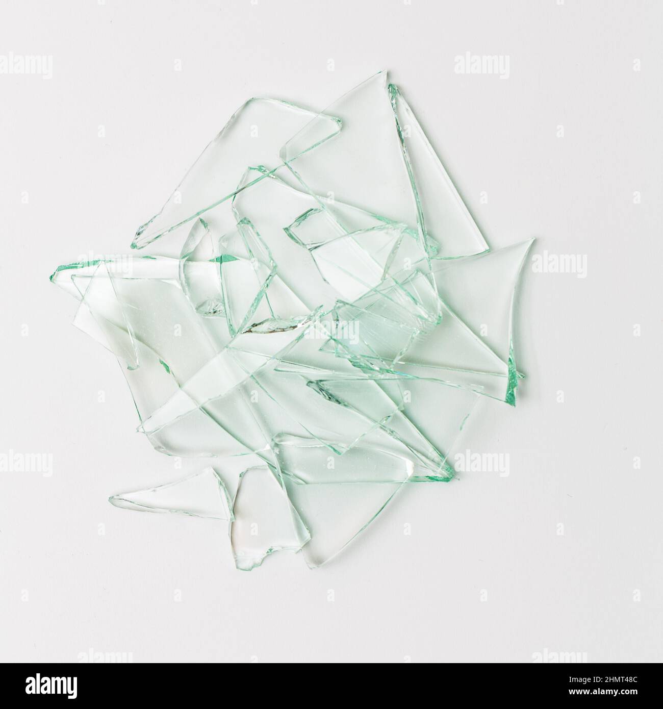 glass shards Broken window heap on white gray background Stock Photo ...