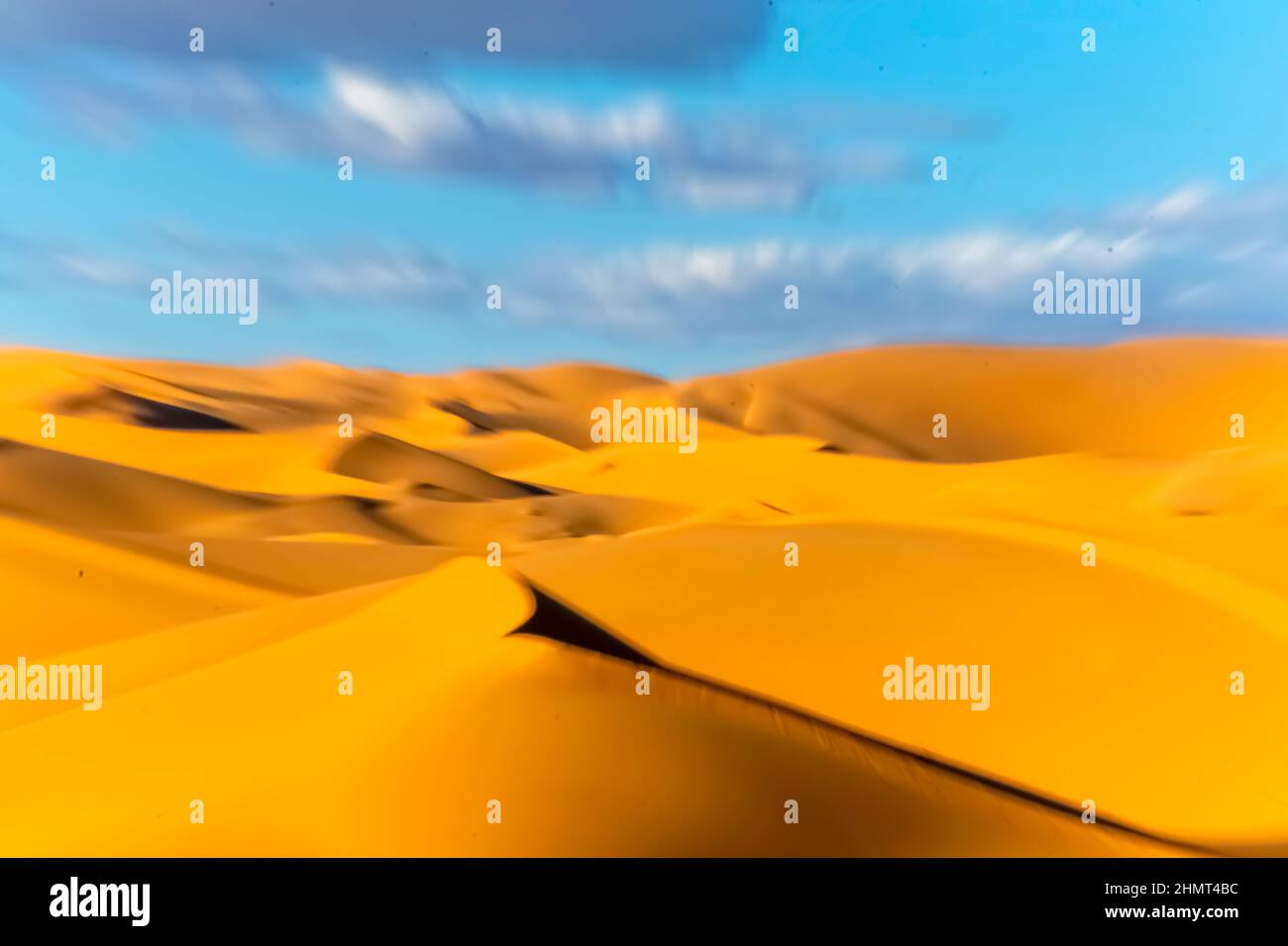 Motion blur effect of a landscape in the Sahara Desert. Golden yellow ...