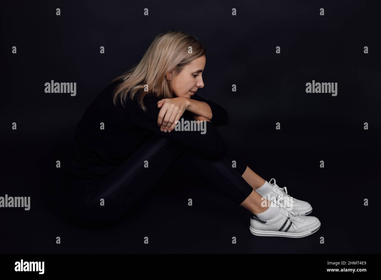 Caucasian Blonde self-contained woman closing herself from other people ...