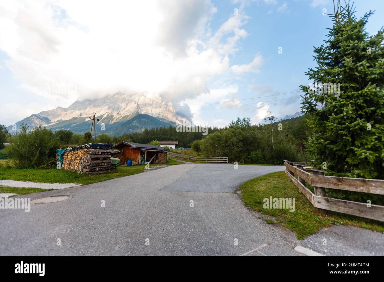 Road turning in the mountains, Alps background Stock Photo - Alamy