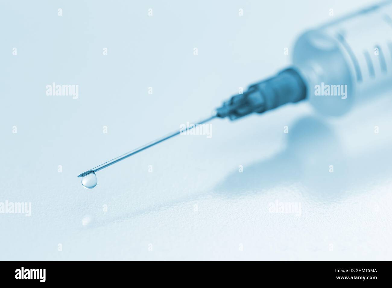 medical syringe with injection solution drop Stock Photo - Alamy