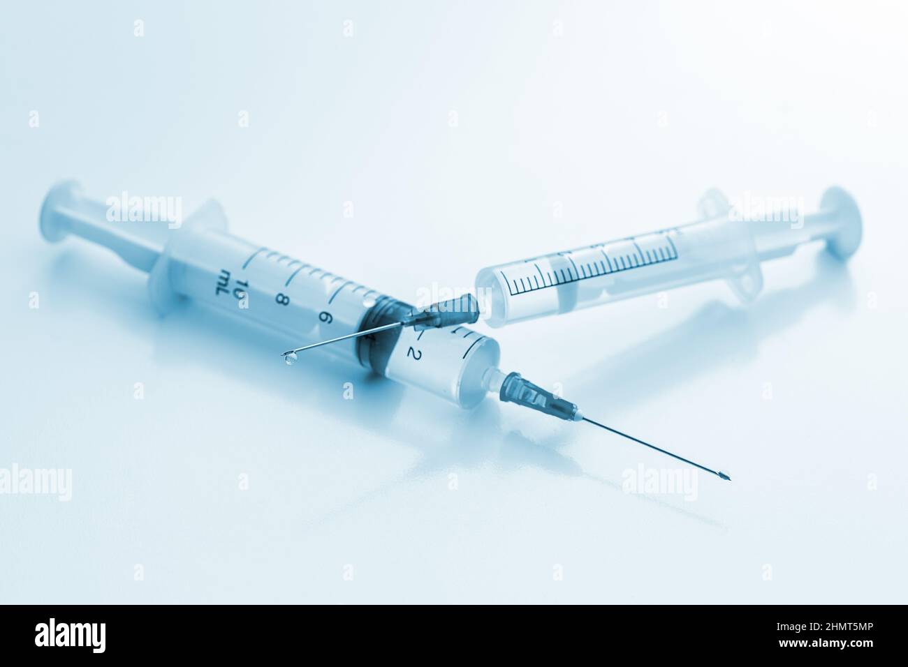 syringe with hypodermic needle and injection solution drop Stock Photo ...