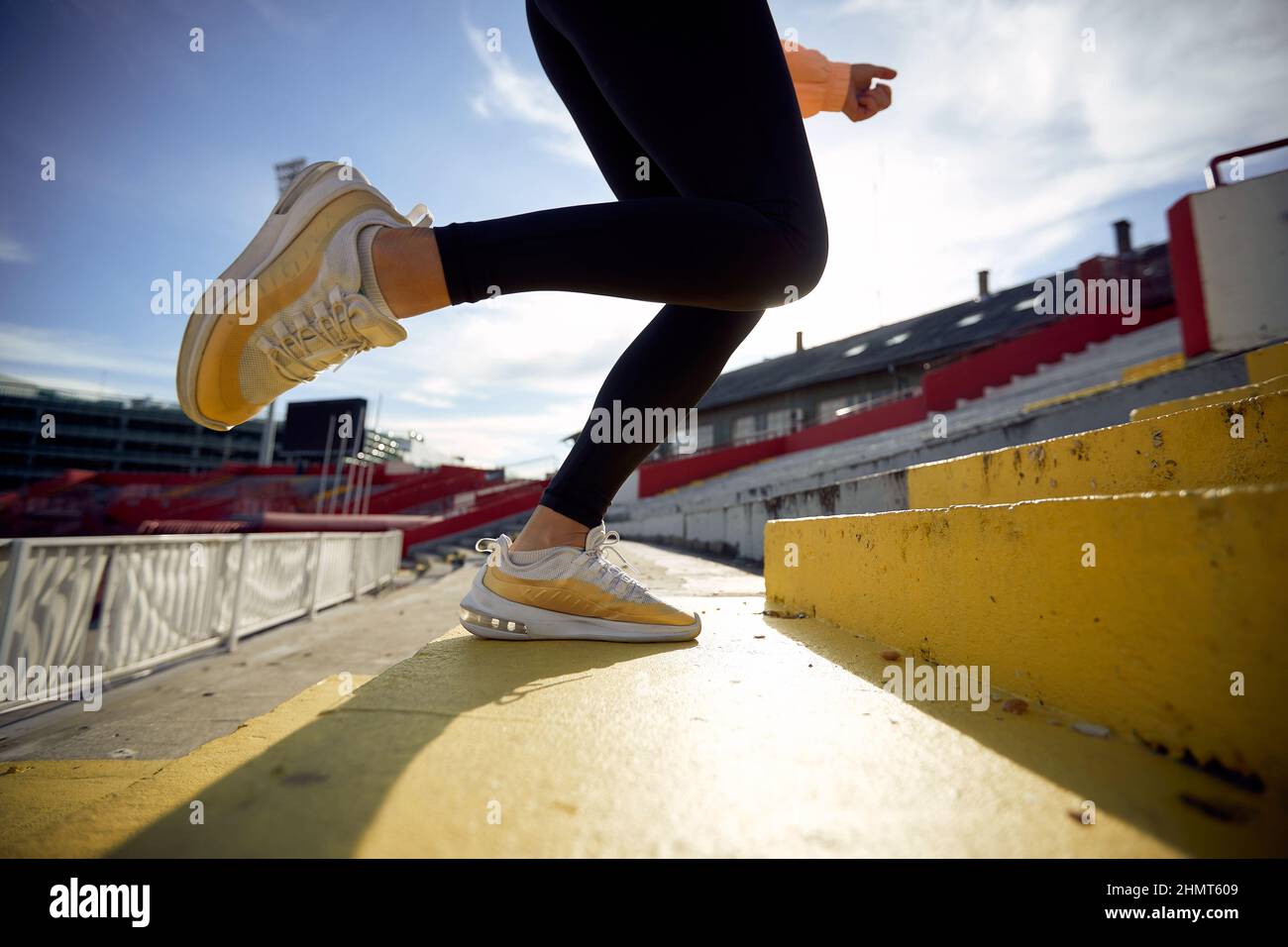 Sporty female working out alone outside on the stairs Stock Photo - Alamy