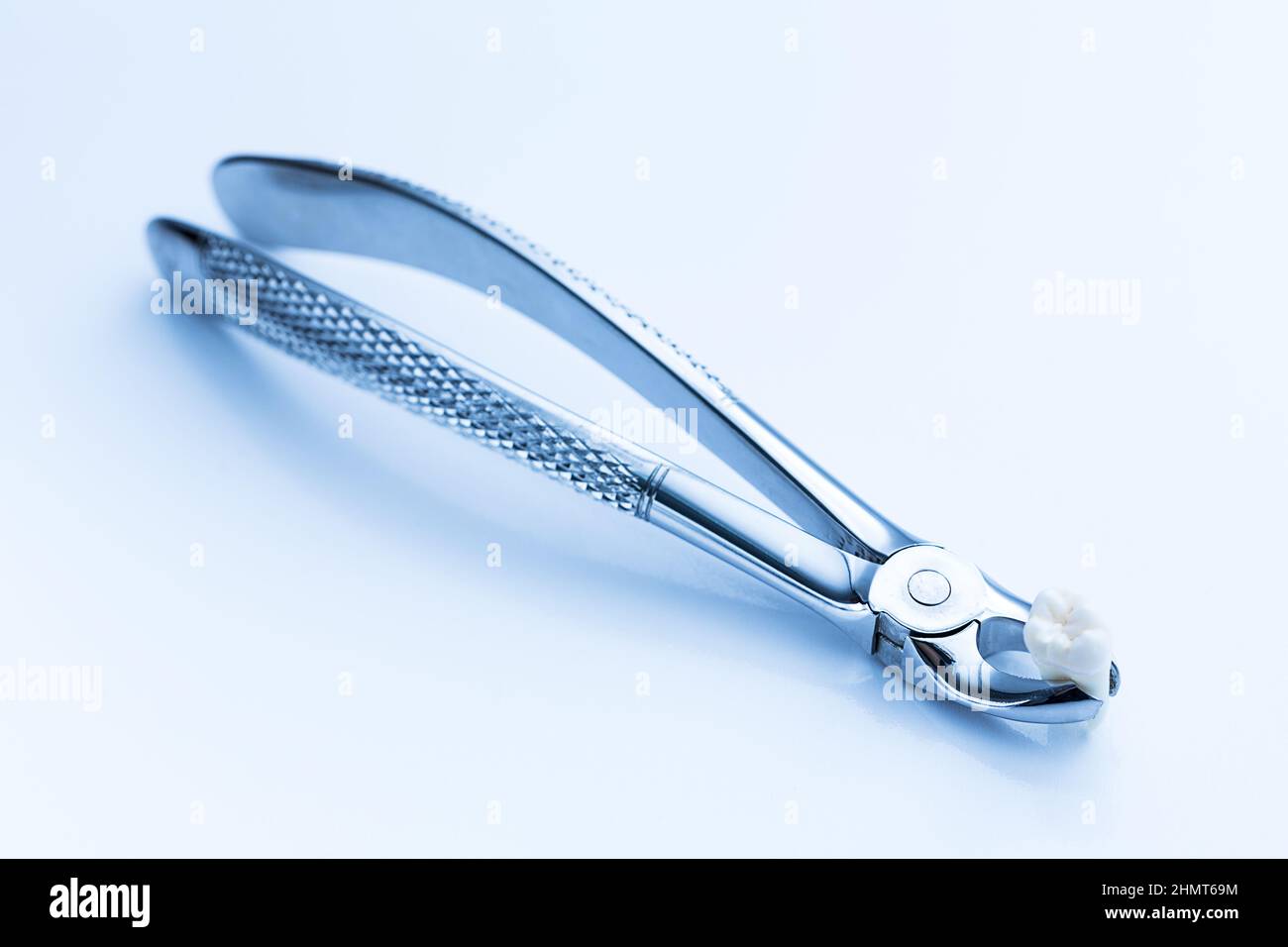 dental forceps for wisdom tooth extraction Stock Photo - Alamy
