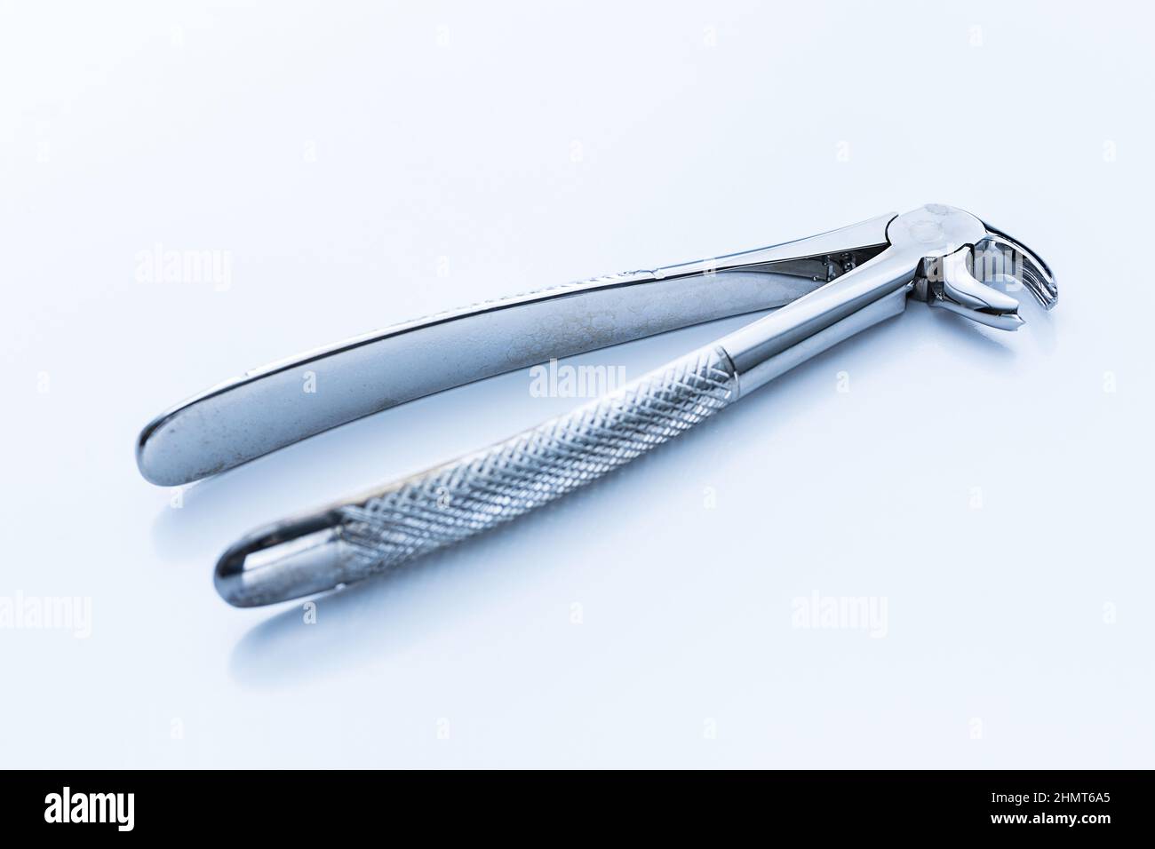 Mandibular wisdom tooth forceps for dentist visiting Stock Photo - Alamy