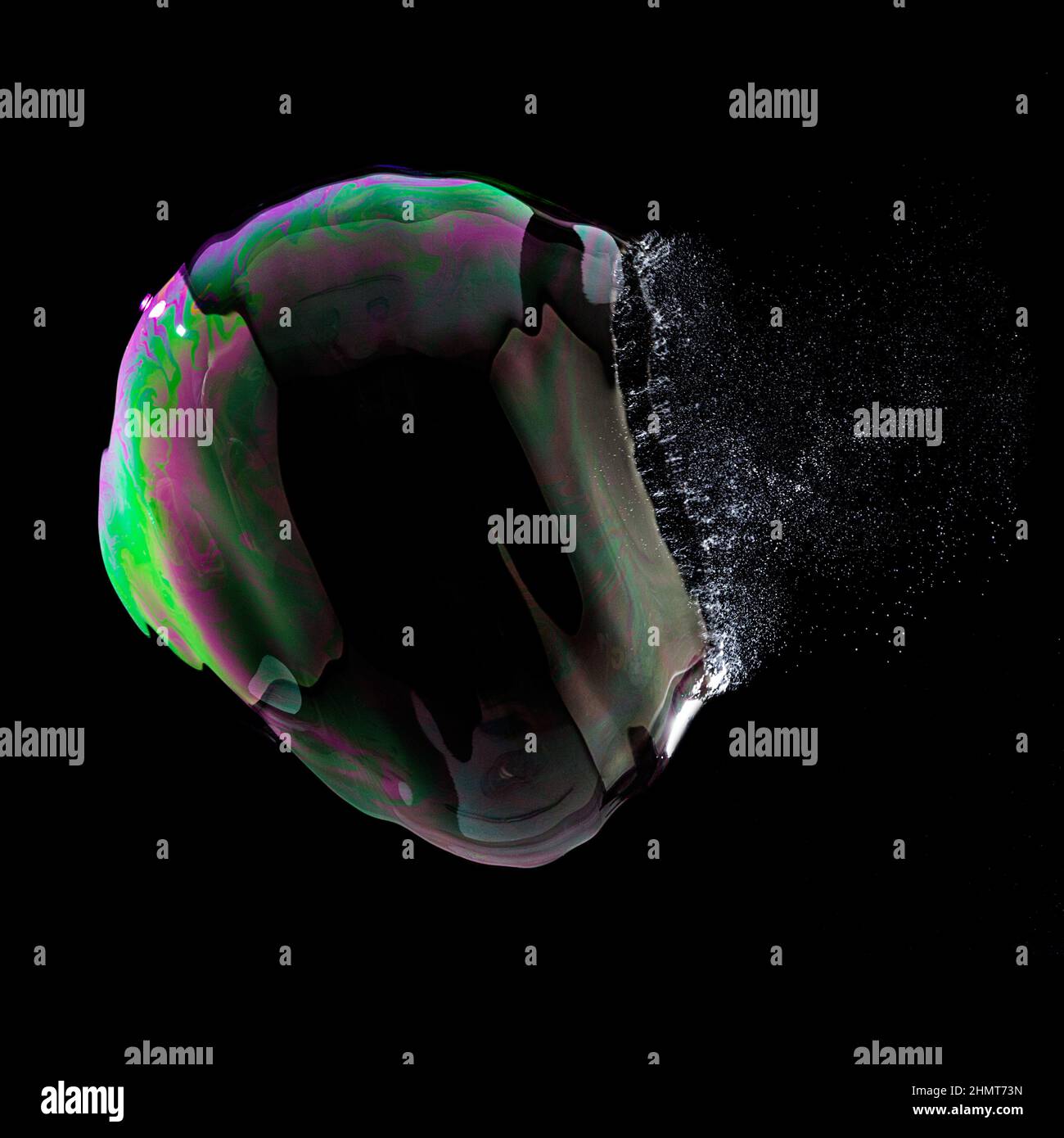 Exploding Soap Bubble in colorful colors on black background Stock ...