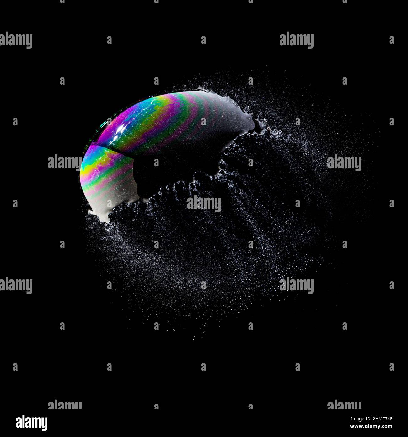 Exploding Soap Bubble in colorful colors on black background Stock ...