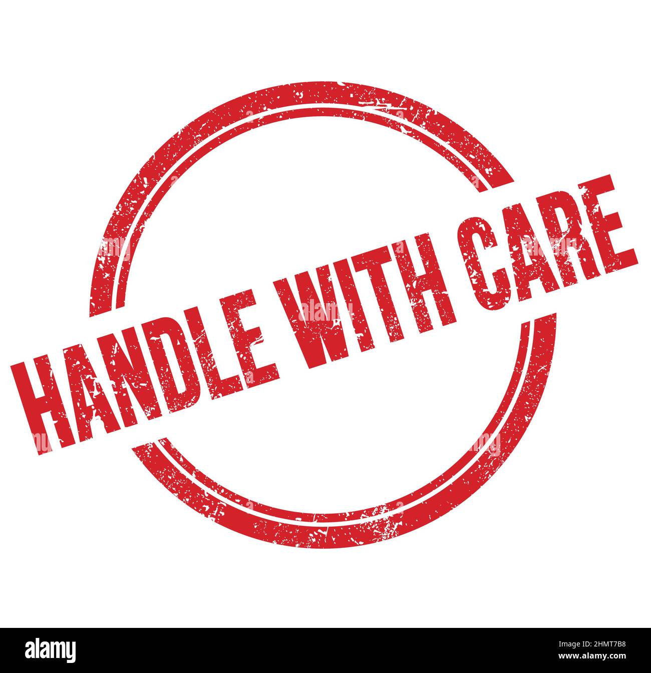 HANDLE WITH CARE text written on red grungy vintage round stamp Stock ...