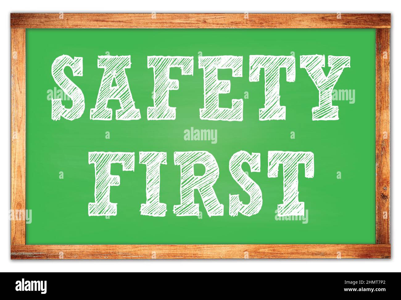 SAFETY FIRST written on green wooden frame school blackboard Stock ...