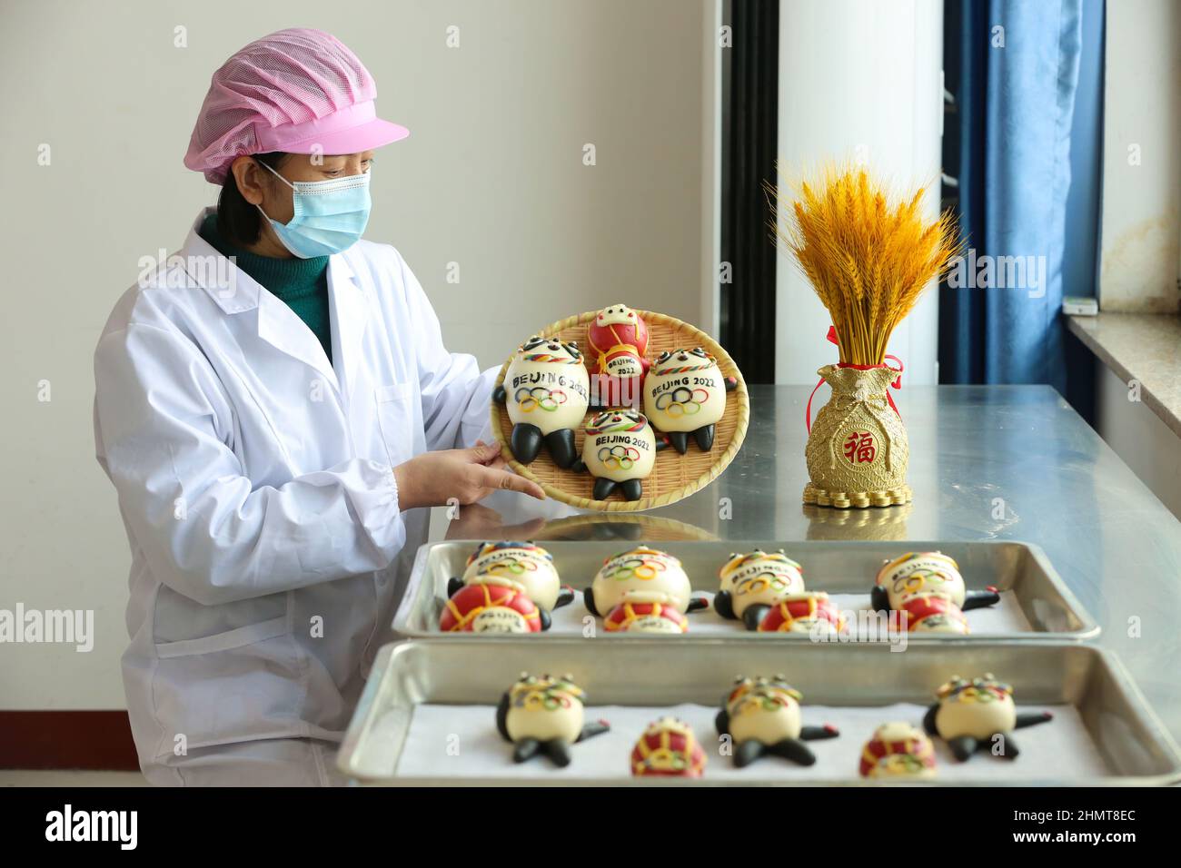 ZOUPING, CHINA - FEBRUARY 12, 2022 - Bakers make steamed buns shaped ...