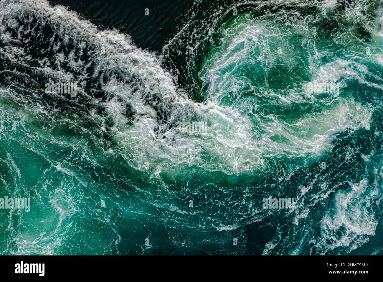 Waves of water of the river and the sea meet each other during high ...