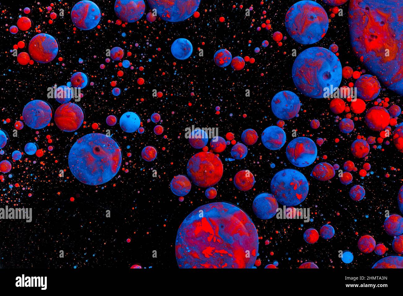 Acrylic color balls on black background Stock Photo - Alamy