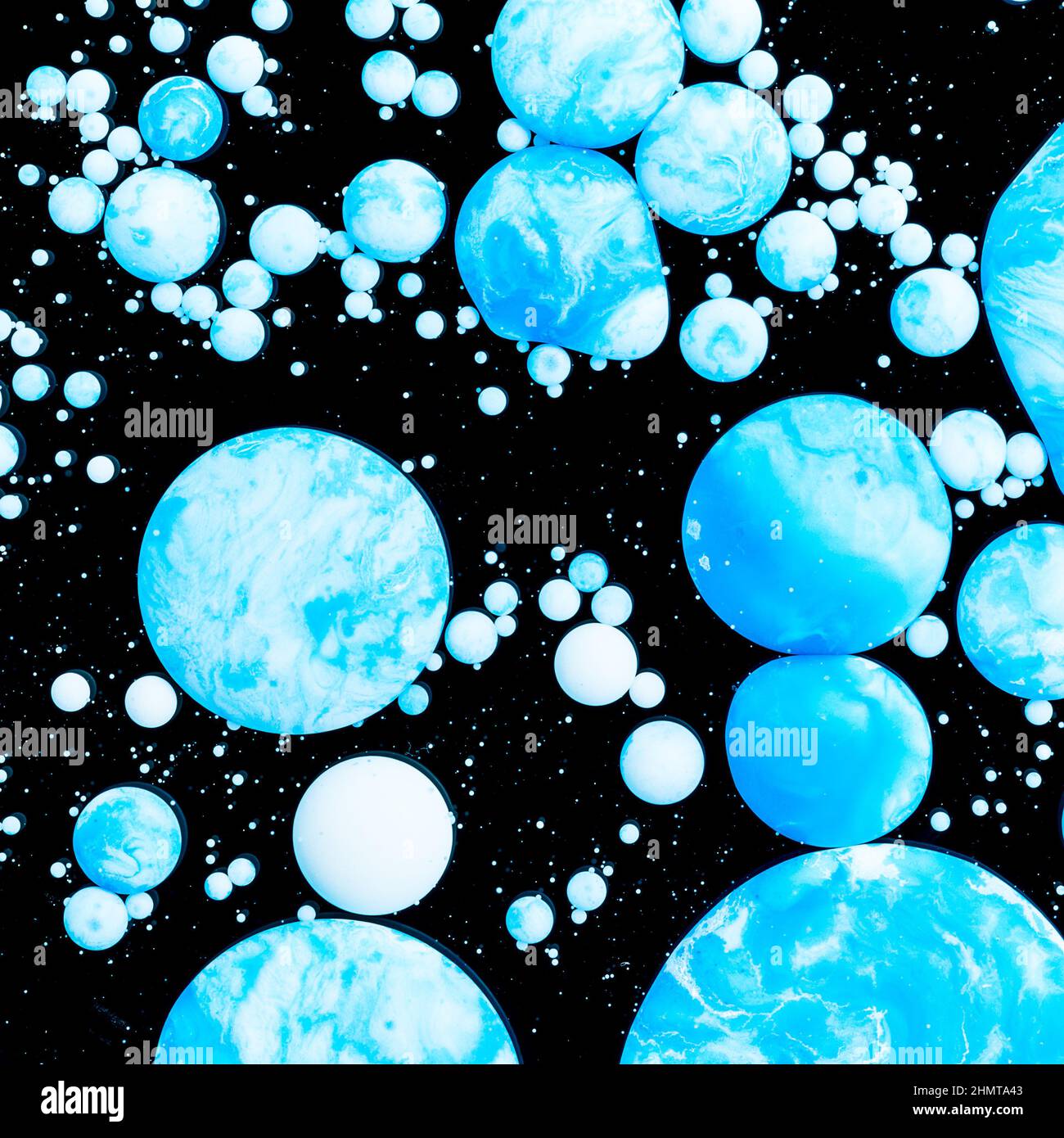 blue and white Acrylic Ink balls Stock Photo - Alamy