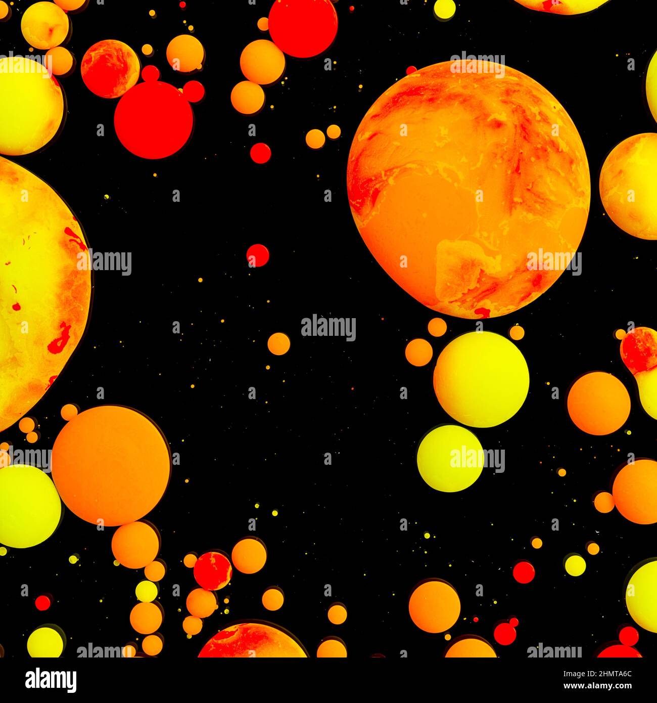 Colorful ink bullets in black Stock Photo - Alamy