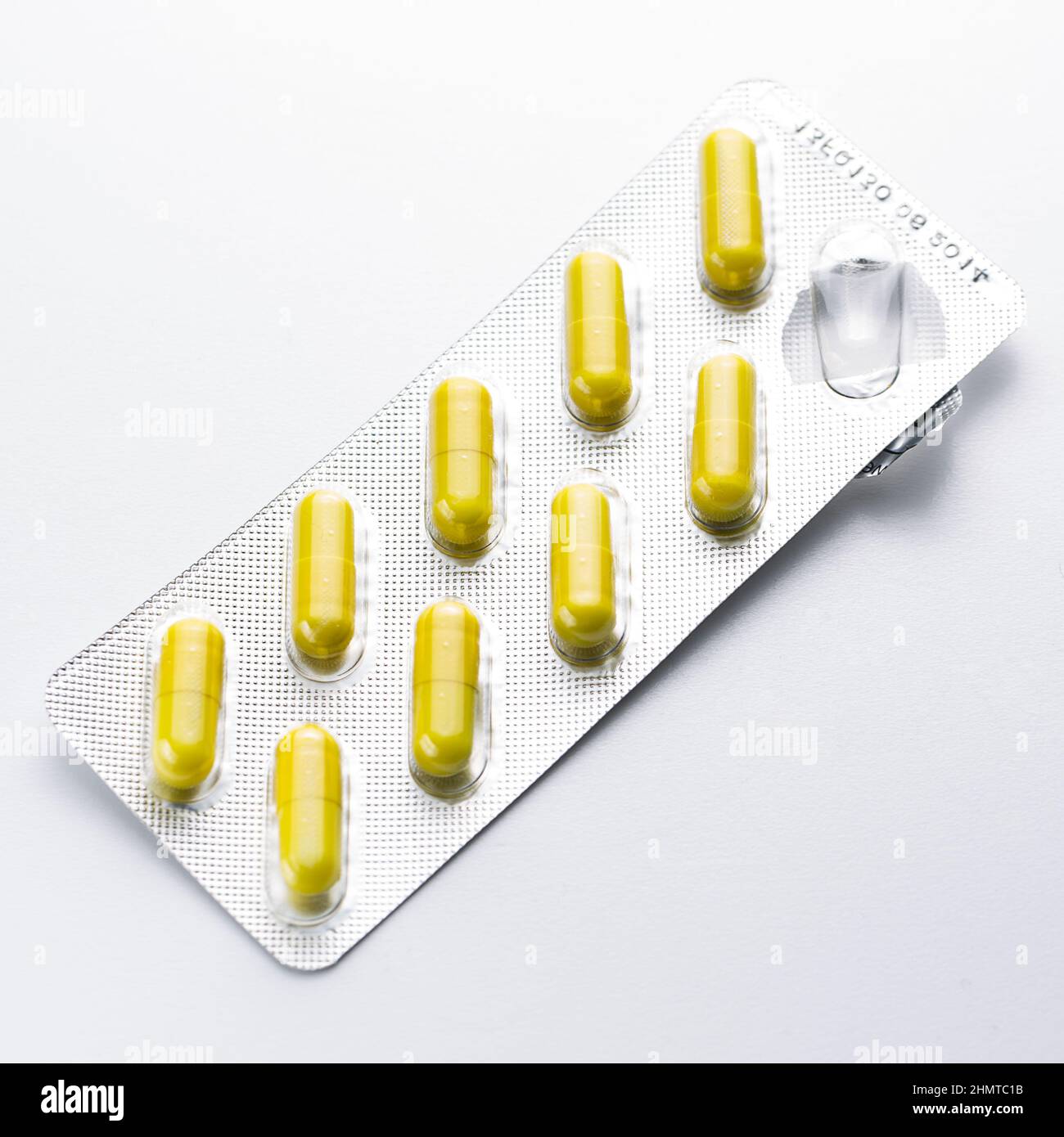 Yellow capsule Tablets pills in a Blister packaging doctor antibiotic ...